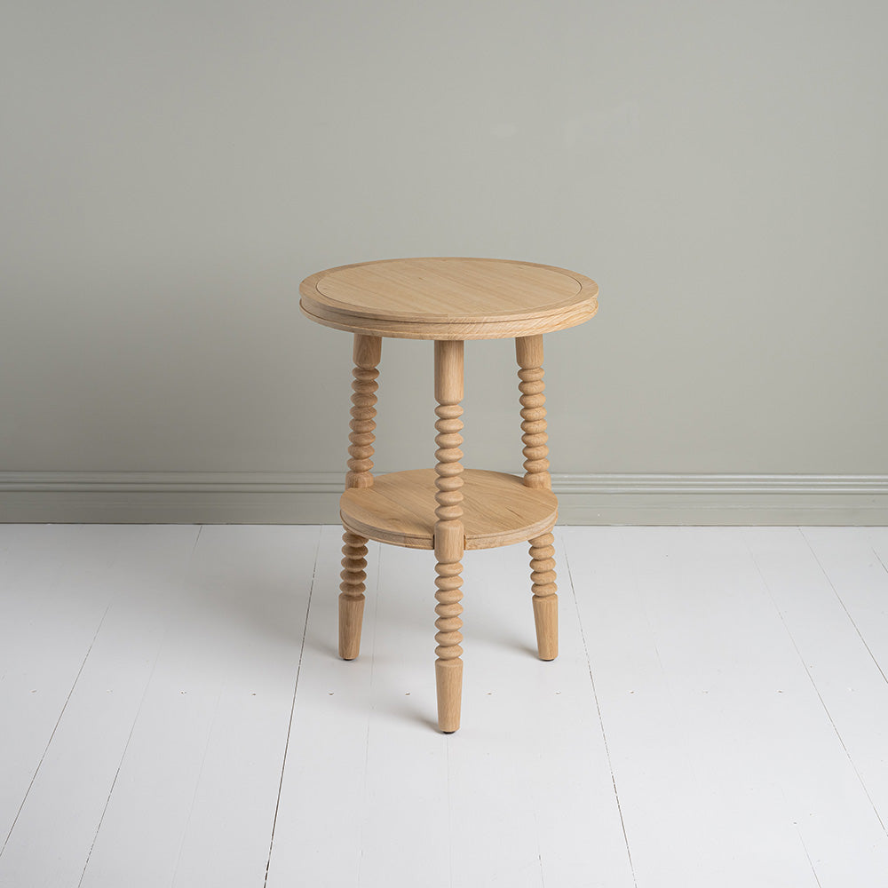Fancy round oiled oak spindle side table by NiX