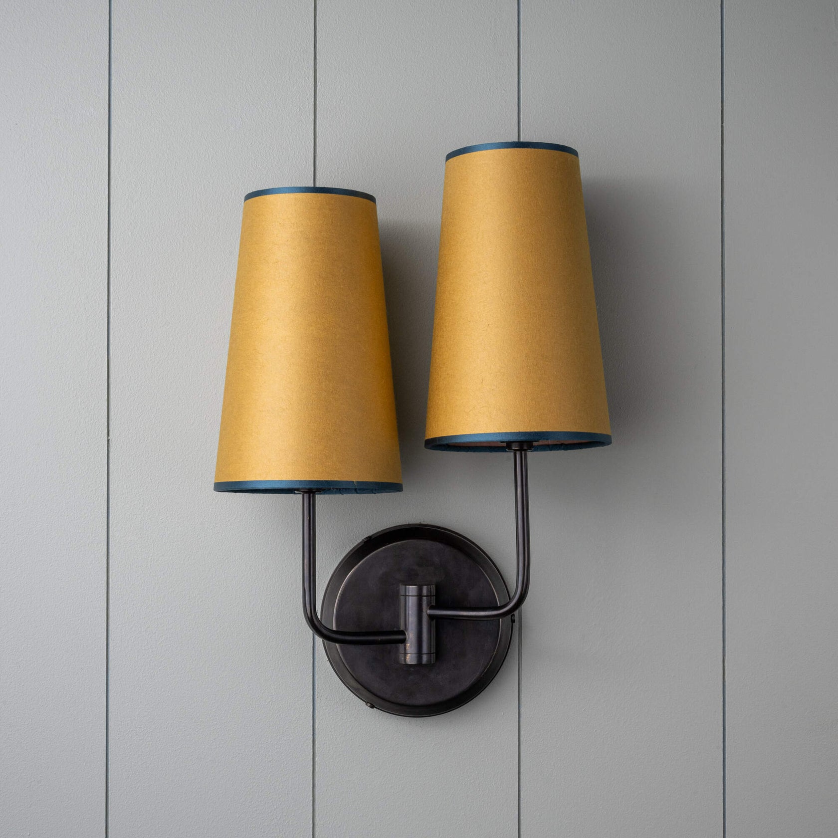Brass double wall light with fancy mustard lampshade